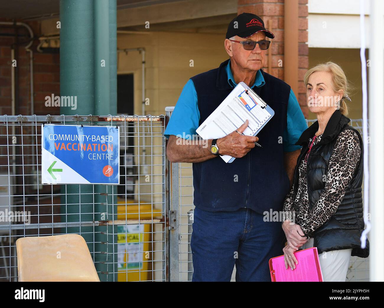 People line up to receive a coronavirus vaccination at the Rocklea ...