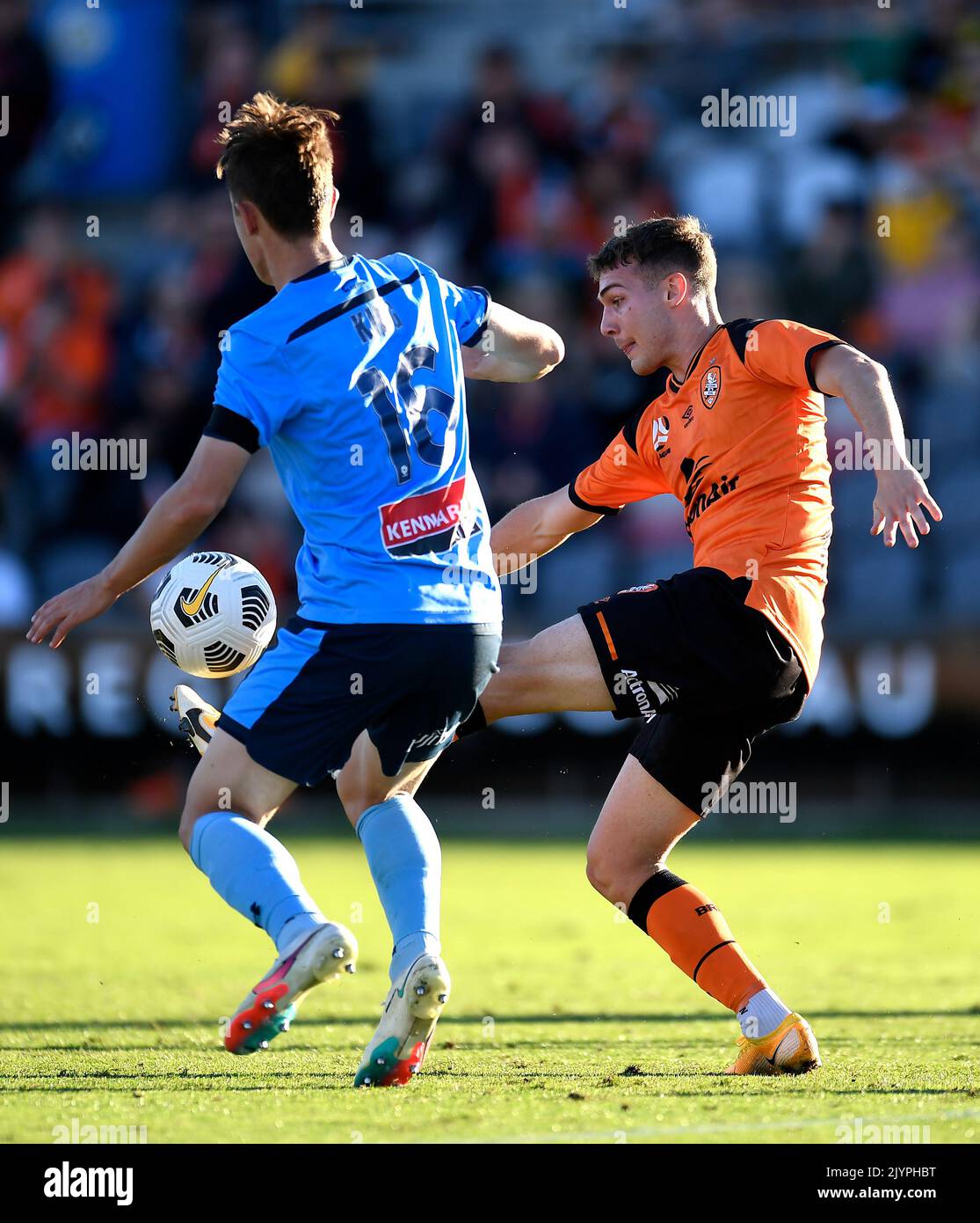 Alex Parsons of the Roar controls the ball under pressure from Joel ...