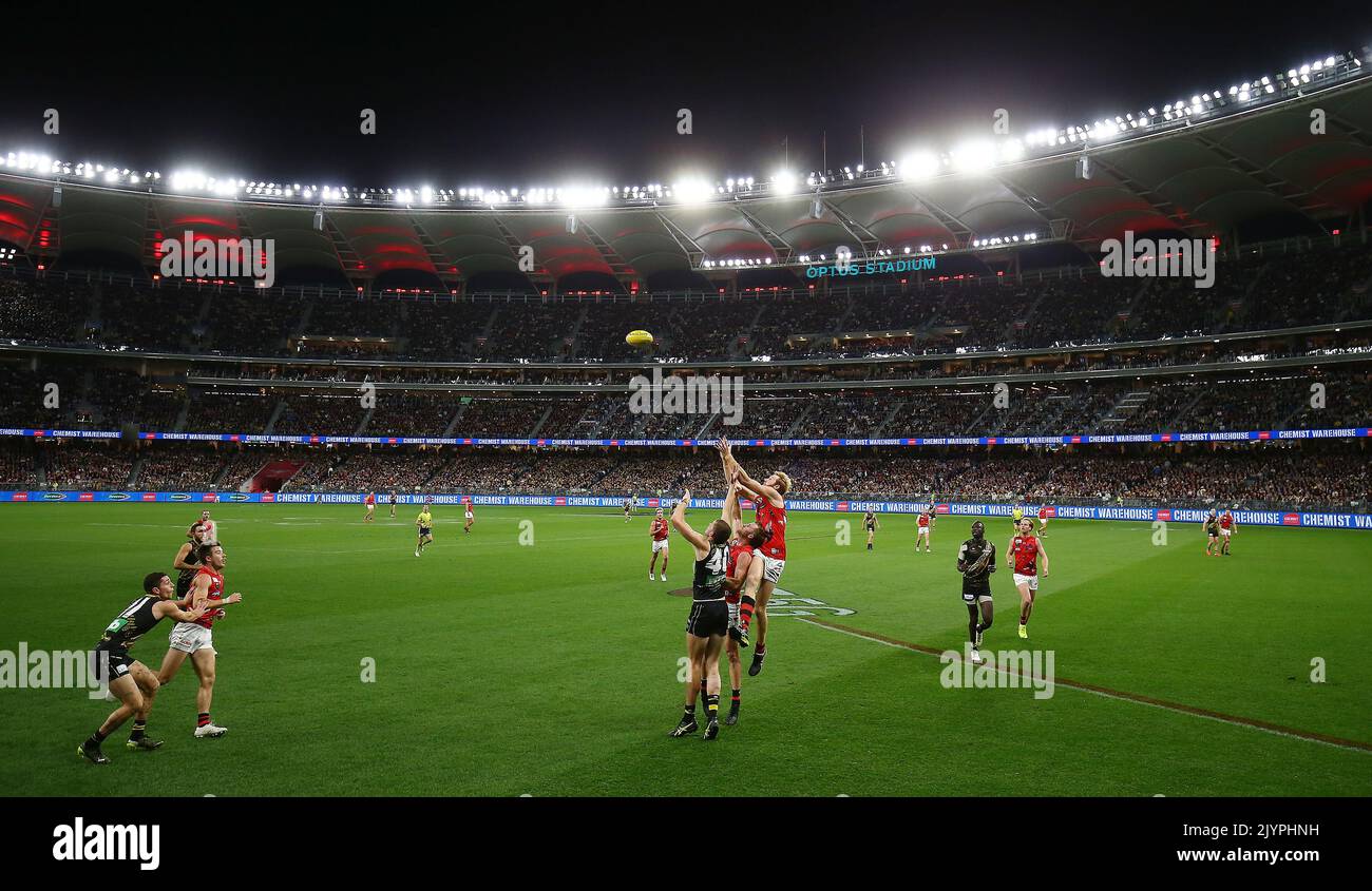 Andrew Phillips of the Bombers challenges with Callum Coleman-Jones of ...