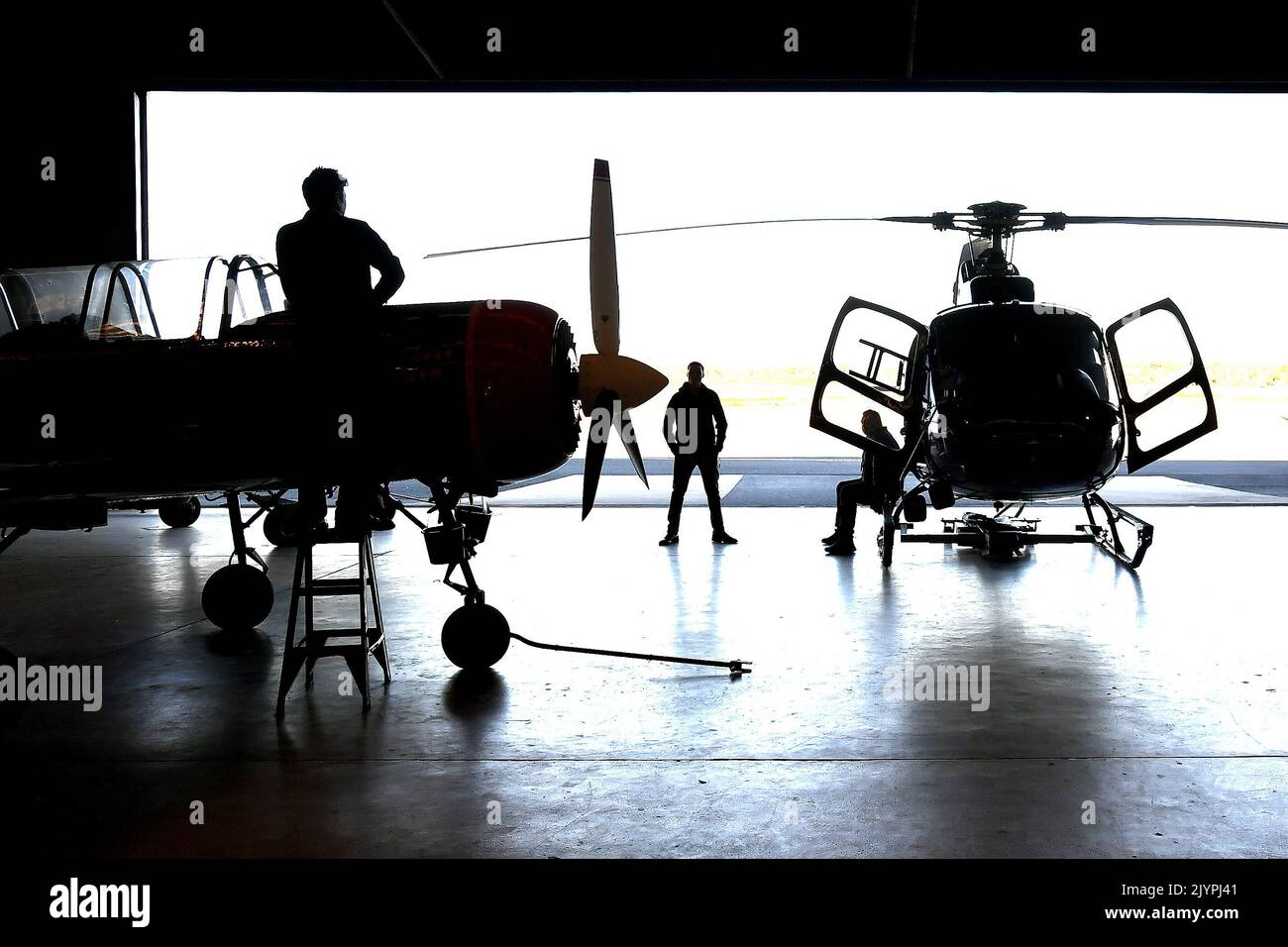 Pilots are seen with aircraft in a hangar at Coolangatta Airport on the ...