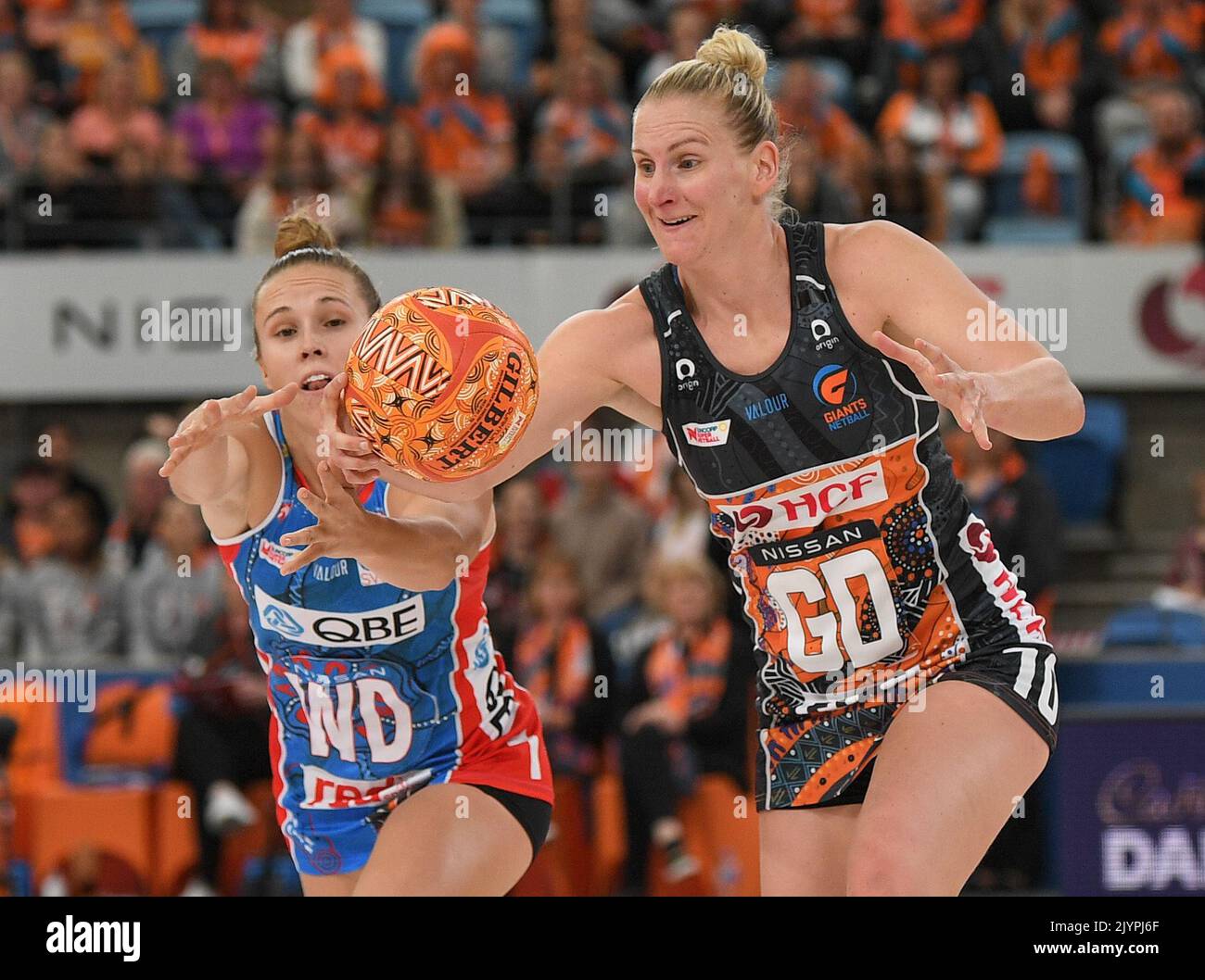 Paige Hadley of the Swifts and April Brandley of the Giants in action ...