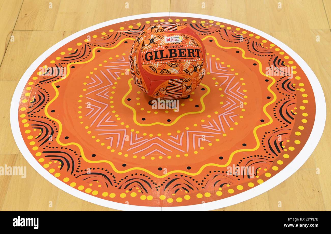 Aboriginal artwork is shown on the ball and centre circle as part of ...