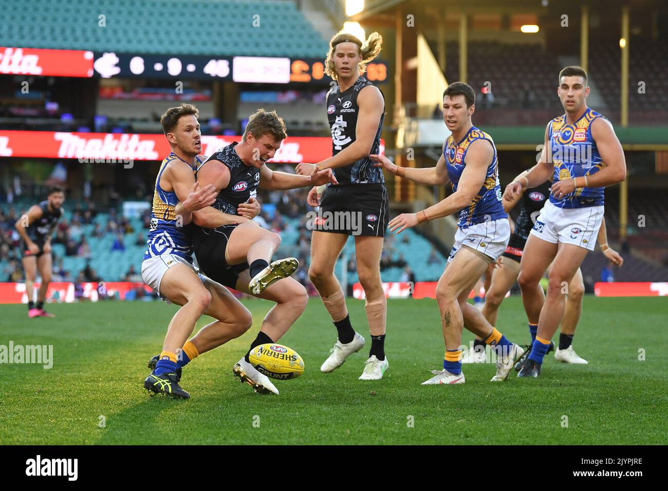 Jack Redden of the Eagles tackles Jack Newnes of the Blues during the ...