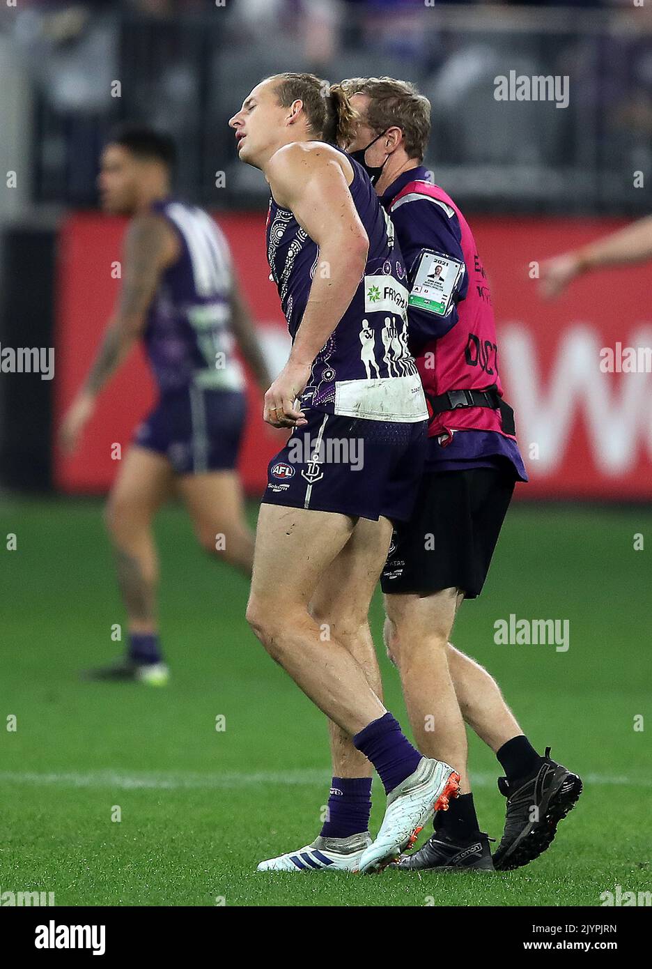 Nat Fyfe of the Dockers goes with an injury during the Round 12 AFL ...