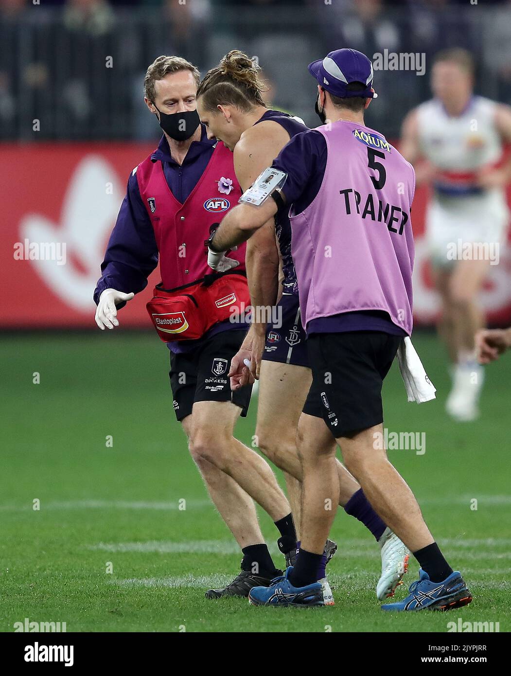 Nat Fyfe of the Dockers goes with an injury during the Round 12 AFL ...