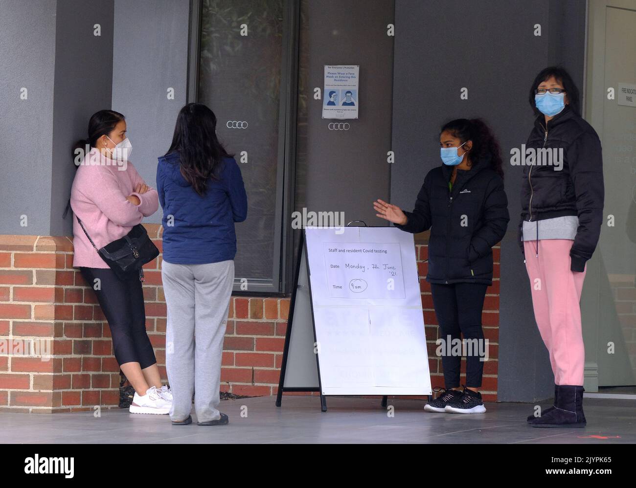 Staff members stand outside the Arcare Maidstone Aged Care Centre in ...