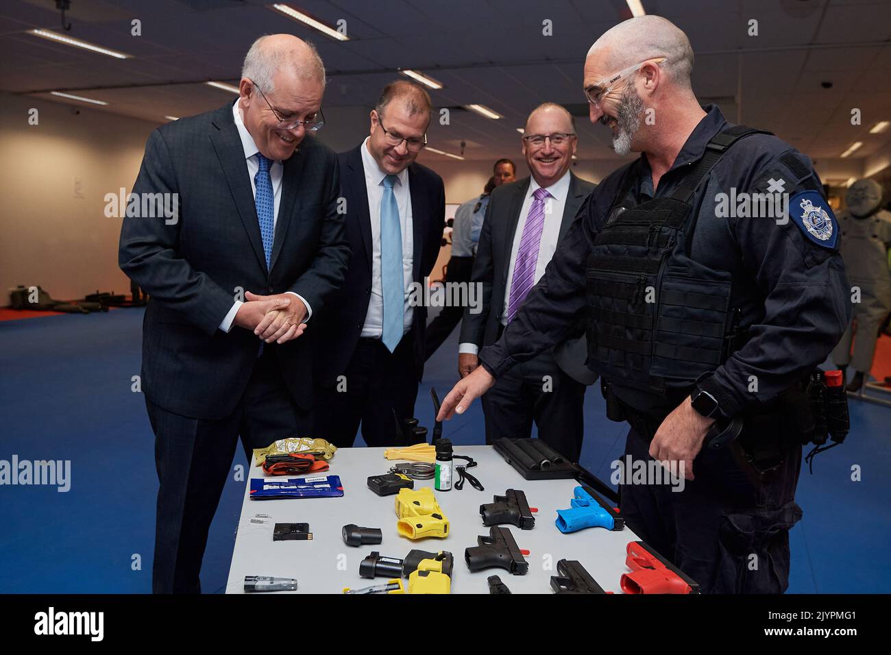 Prime Minister Scott Morrison is shown various weapons during a visit ...