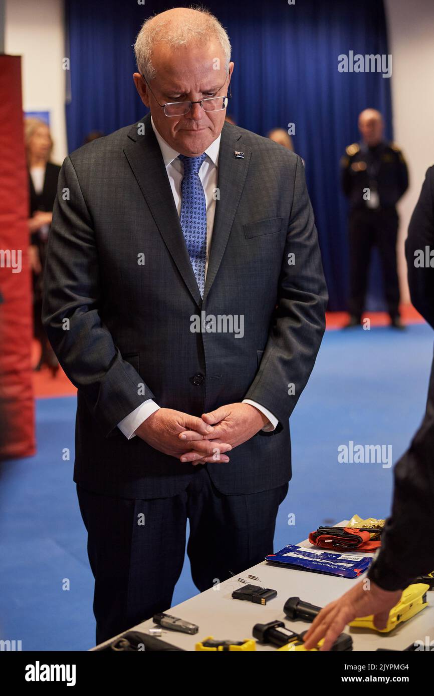 Prime Minister Scott Morrison is shown various weapons during a visit ...