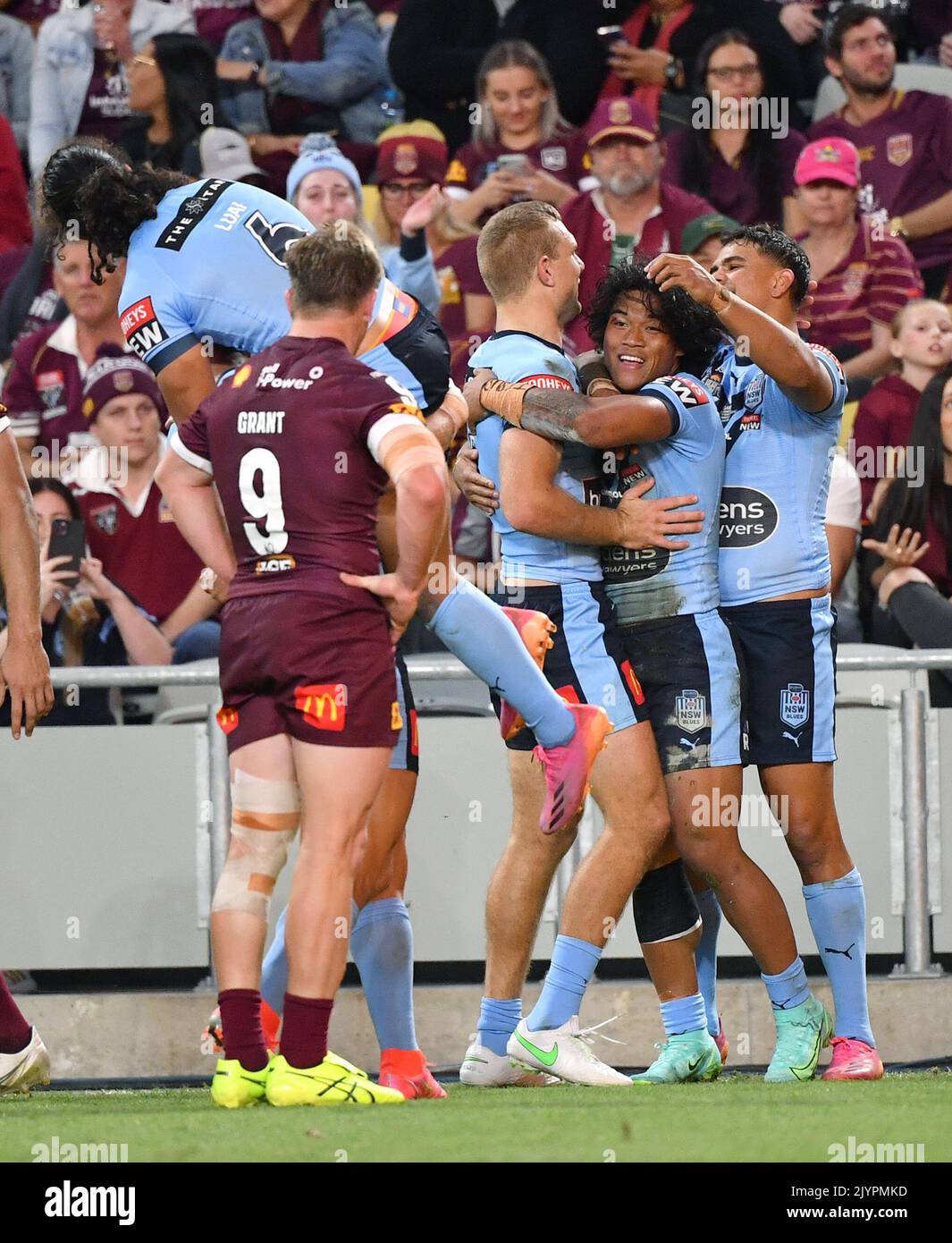 Brian To'o (2nd from right) of the Blues celebrates scoring a try with ...