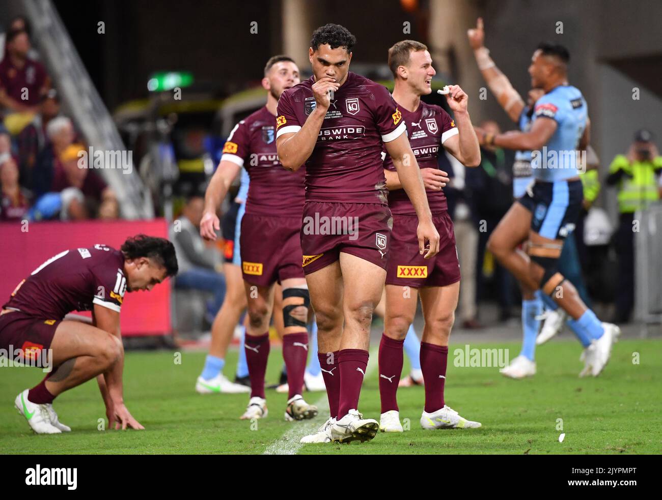 Xavier Coates of the Maroons looks on after a try is scored against ...
