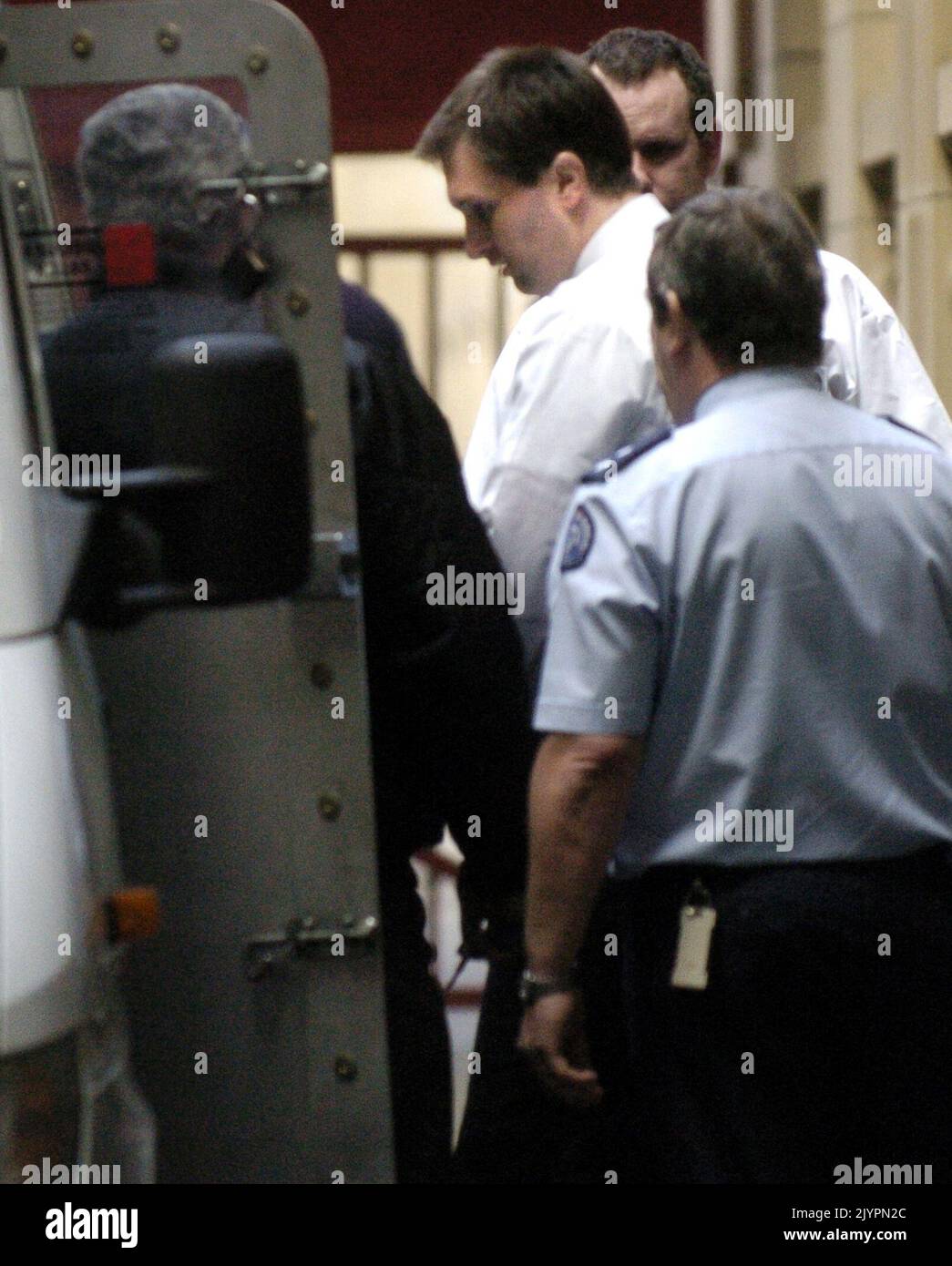 Melbourne, August 5, 2005. John Myles Sharpe is led away by prison ...
