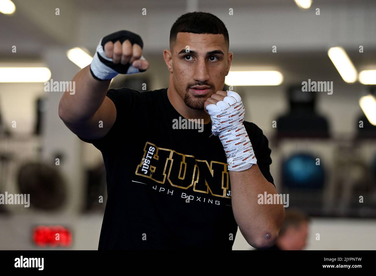 Australian heavyweight champion Justis Huni poses for a photograph ...
