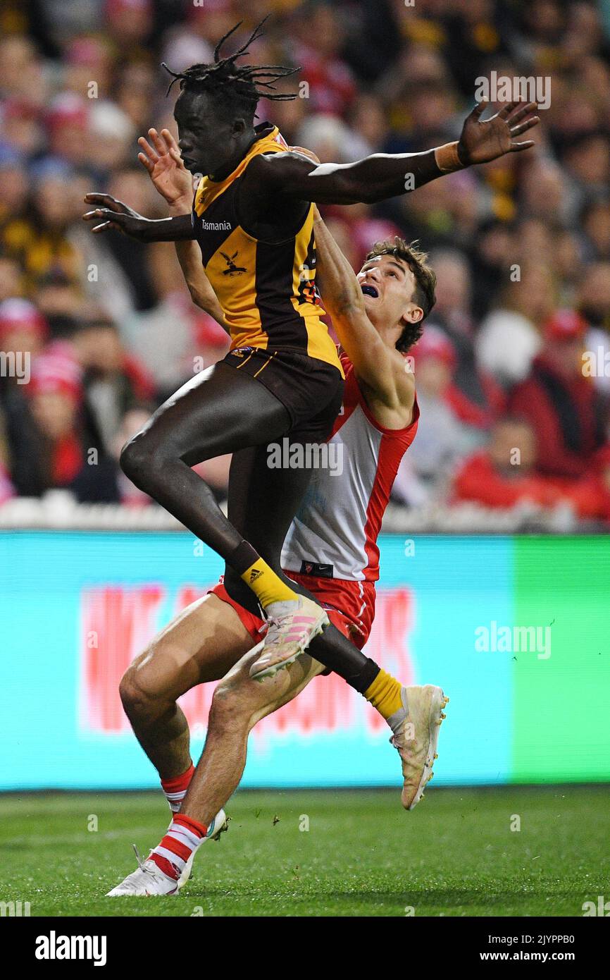 Changkuoth Jiath of the Hawks and Sam Wicks of the Swans during the ...