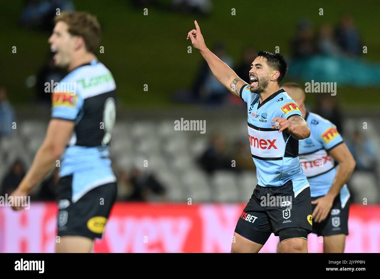 Shaun Johnson of the Sharks celebrates kicking the winning field goal ...
