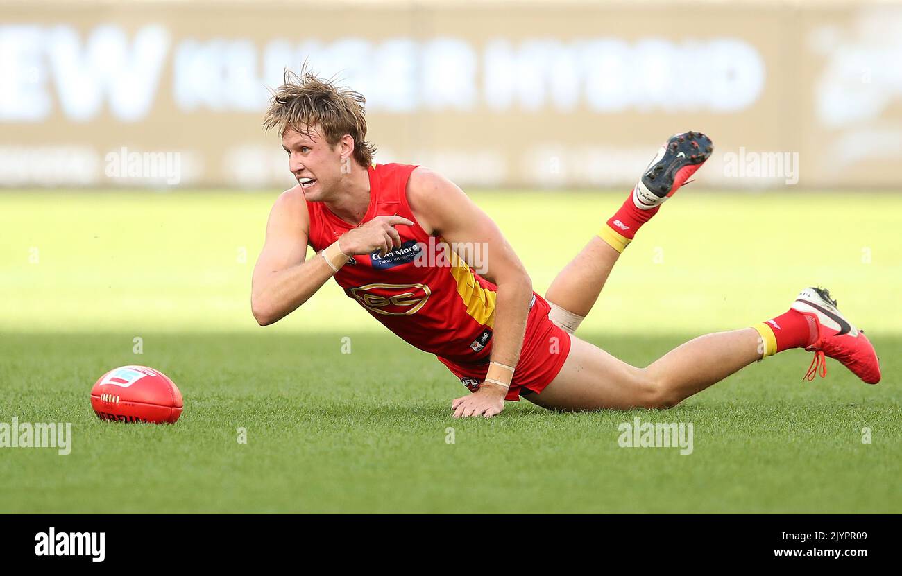 Jack Lukosius of the Suns tries to gather the ball during the Round 13 ...