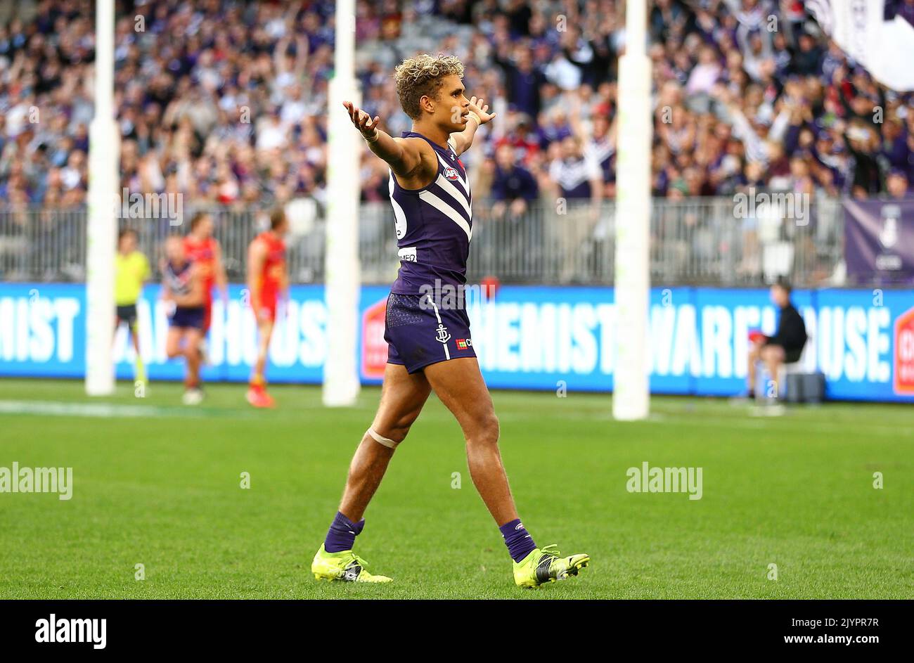 Liam Henry of the Dockers celebrates kicking a goal during the Round 13 ...