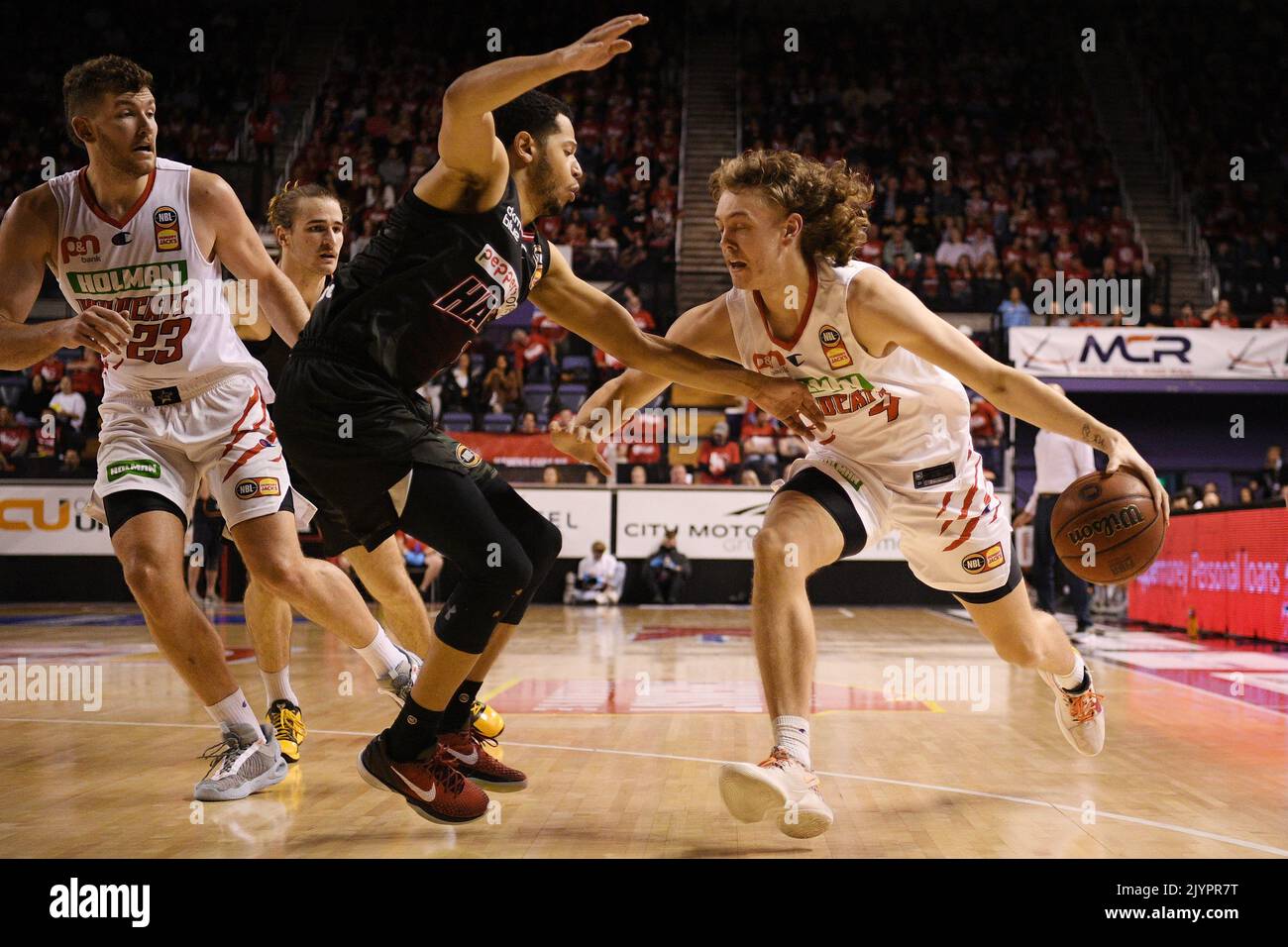Luke Travers of the Wildcats and Tyler Harvey of the Hawks during Game ...