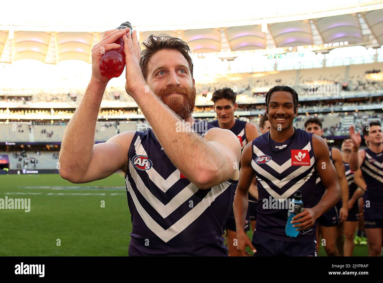 Reece Conca of the Dockers leads the Dockers team from the field after ...