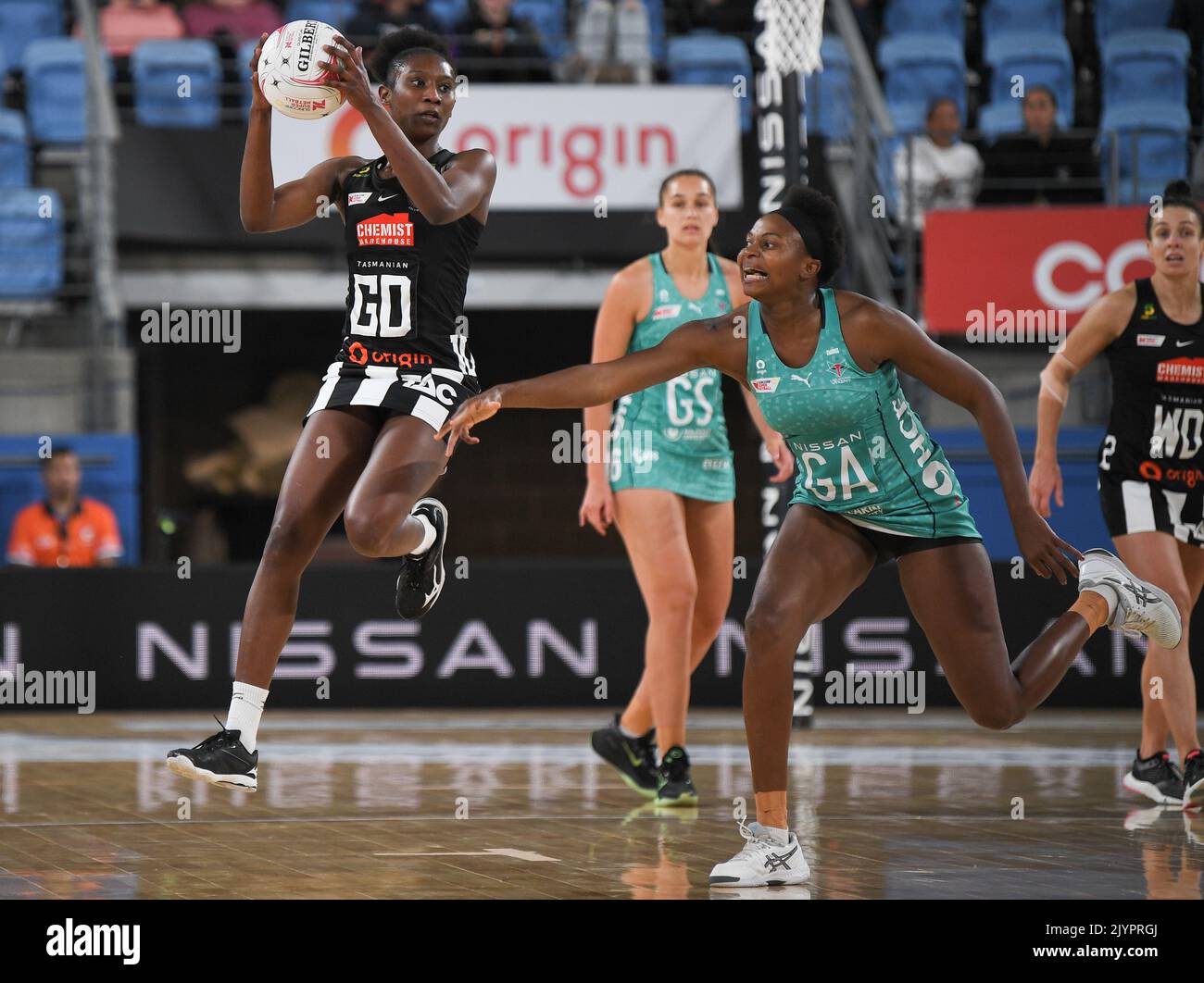 Jodi-Ann Ward of the Magpies and Mwai Kumwenda of the Vixens during the ...