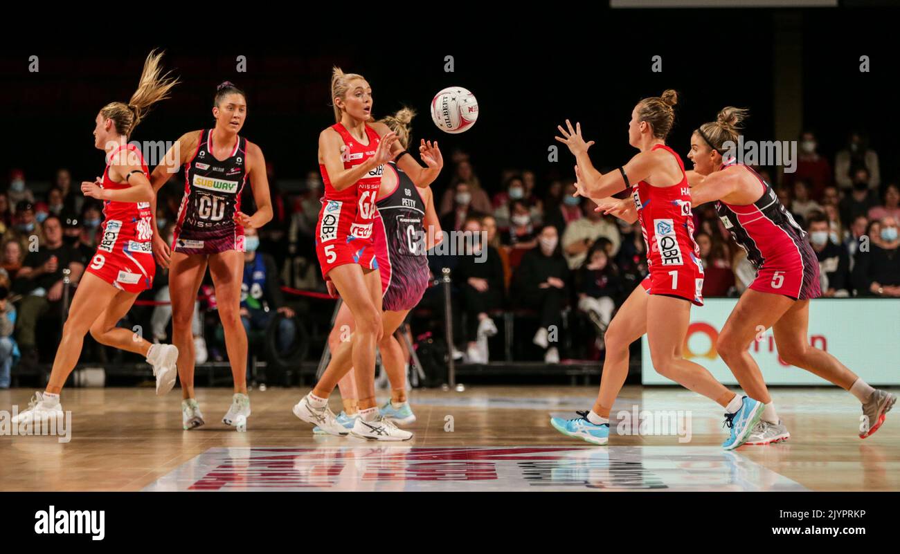 Helen Housby passes to team mate Sarah Klau of the Swifts during the ...