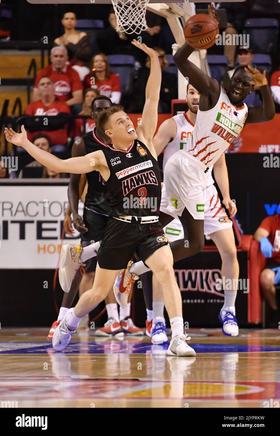 Isaac White of the Hawks and Wani Swaka Lo Buluk of the Wildcats during ...