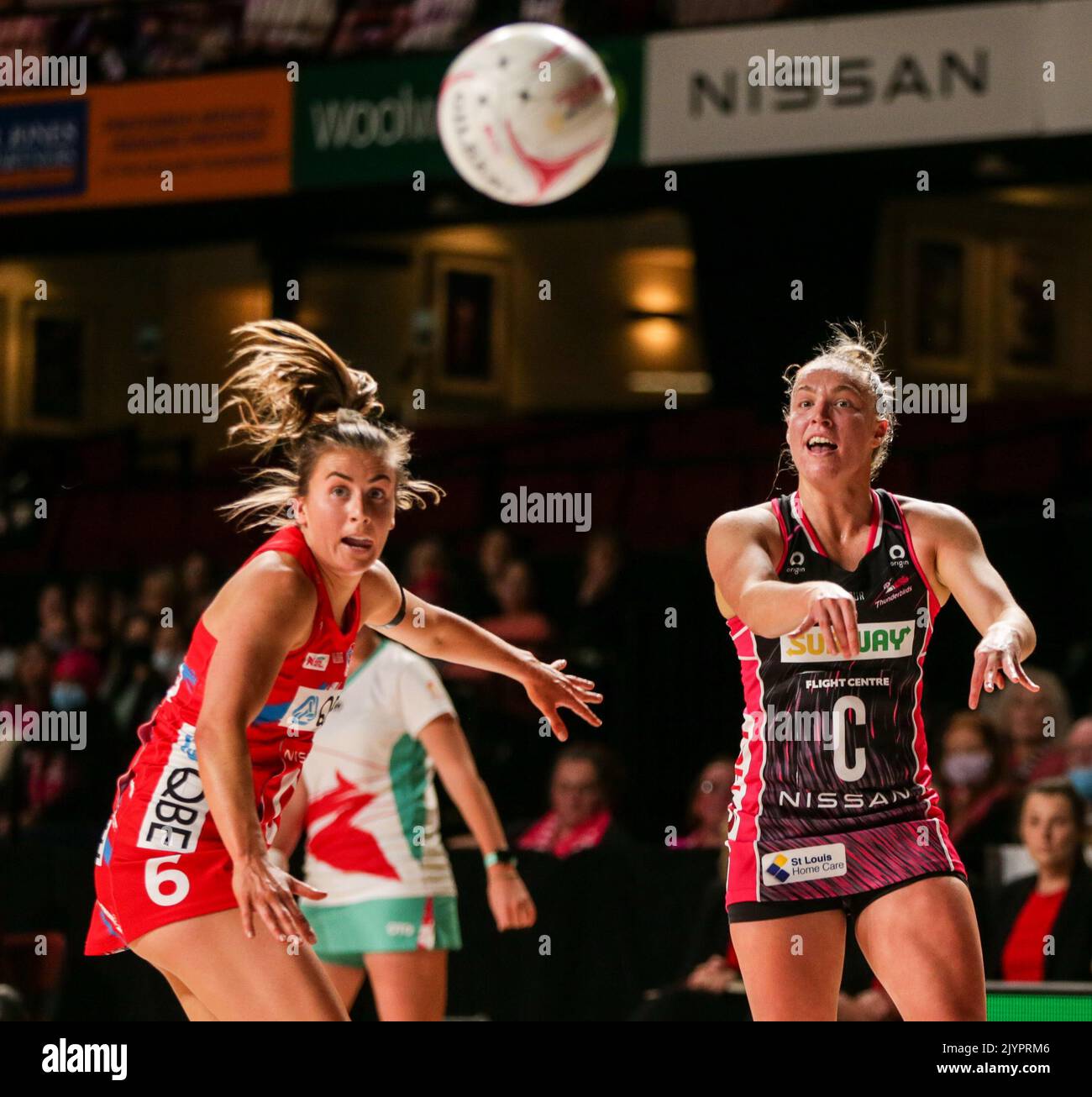 Hannah Petty of the Thunderbirds passes past Maddy Proud of the Swifts ...
