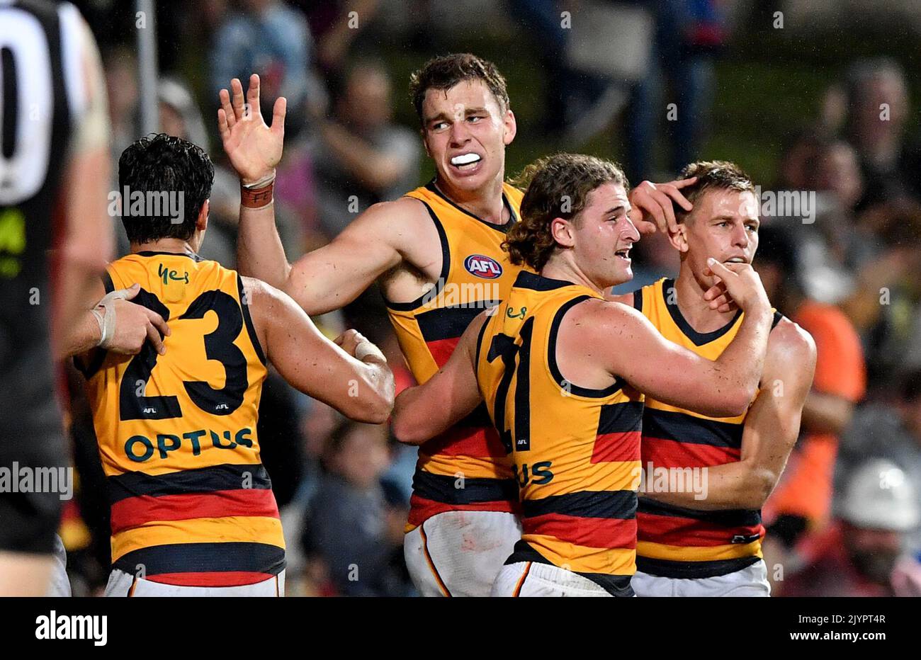 Riley Thilthorpe (centre) of the Crows celebrates kicking the winning ...