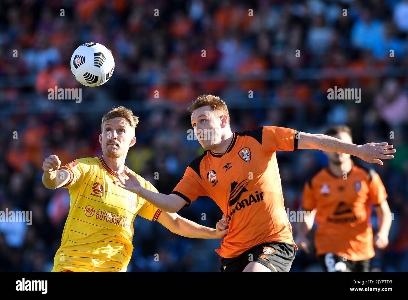 Ben Halloran of Adelaide United and Corey Brown of the Roar compete for ...