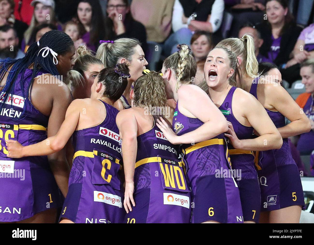 Kimberley Jenner ( right ) of the Firebirds reacts in the team huddle ...
