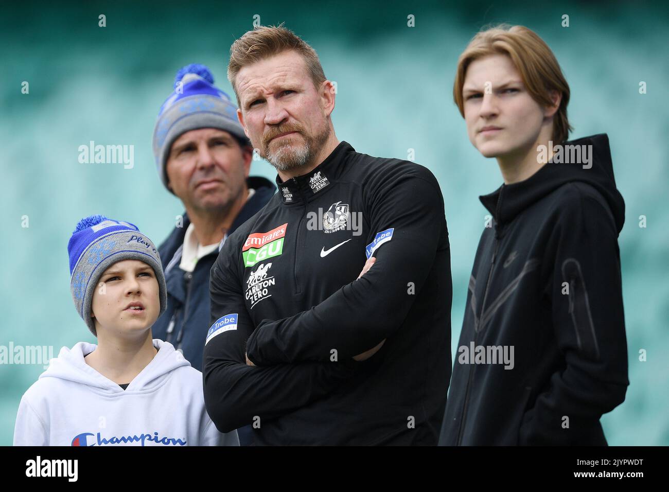 Magpies coach Nathan Buckley (centre) with sons Jett (right) and Ayce ...