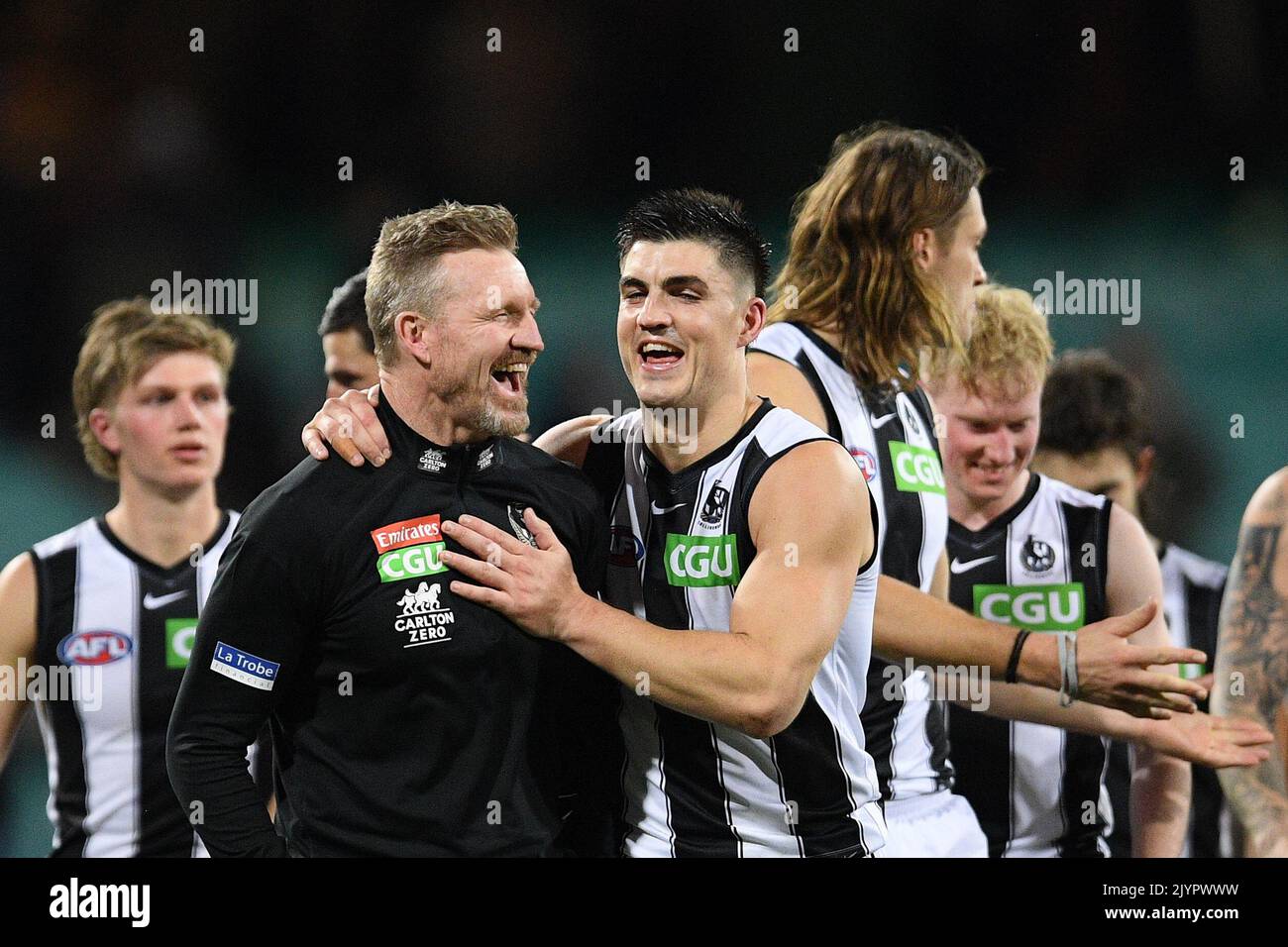 Departing head coach Nathan Buckley laughs with Brayden Maynard after ...
