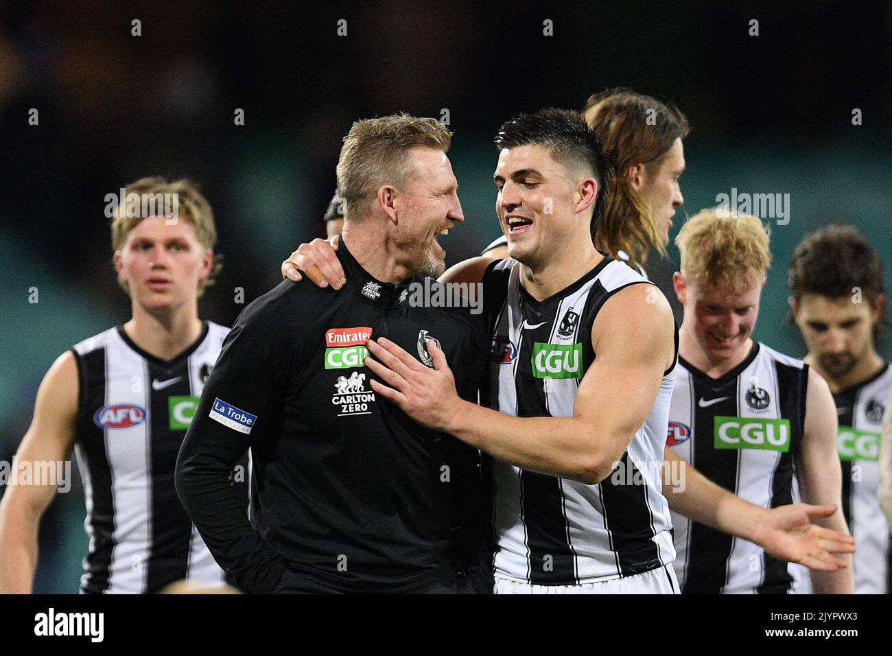 Departing head coach Nathan Buckley laughs with Brayden Maynard after ...
