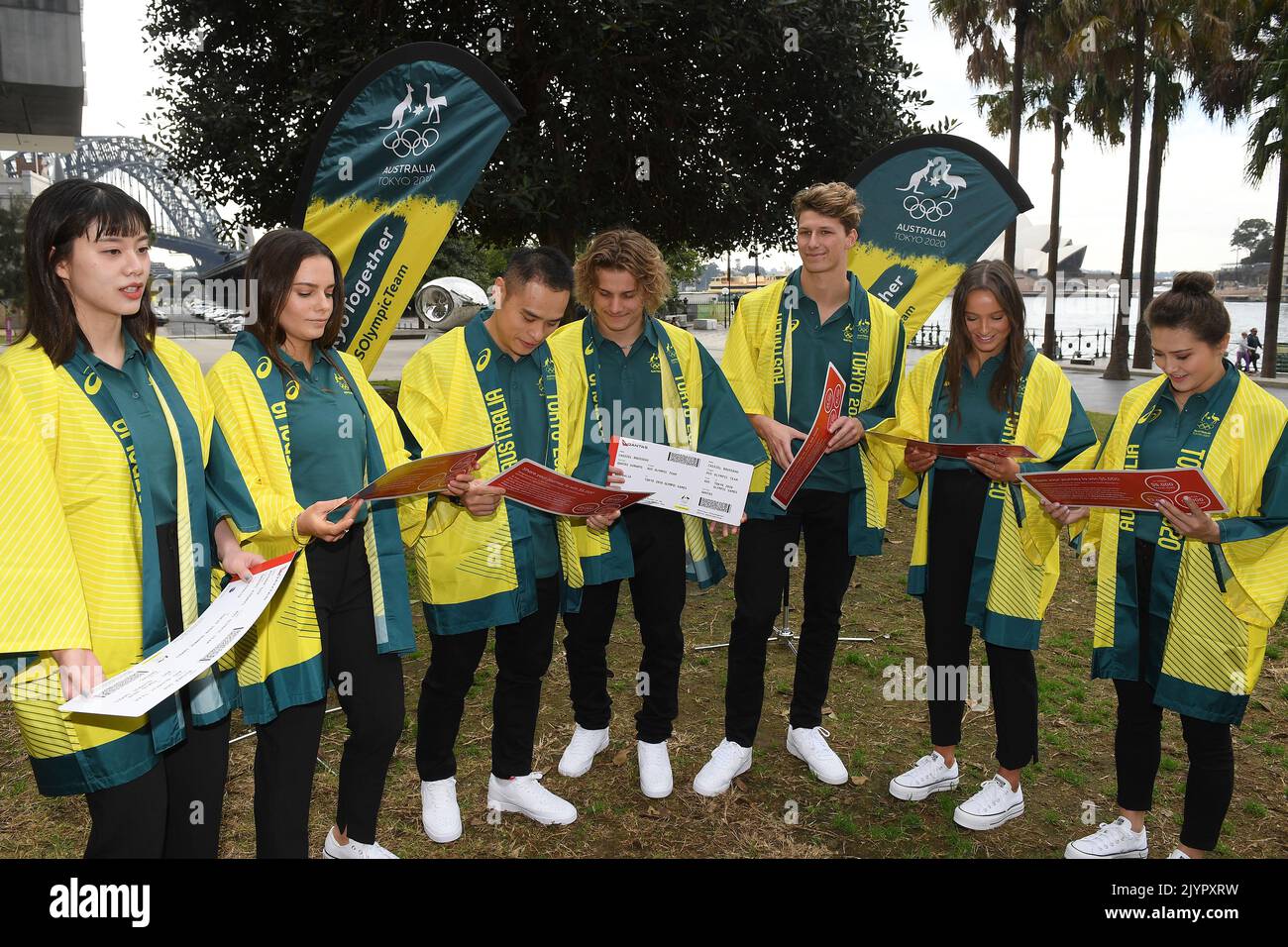 The Australian Olympic Diving team look at their boarding passes during ...