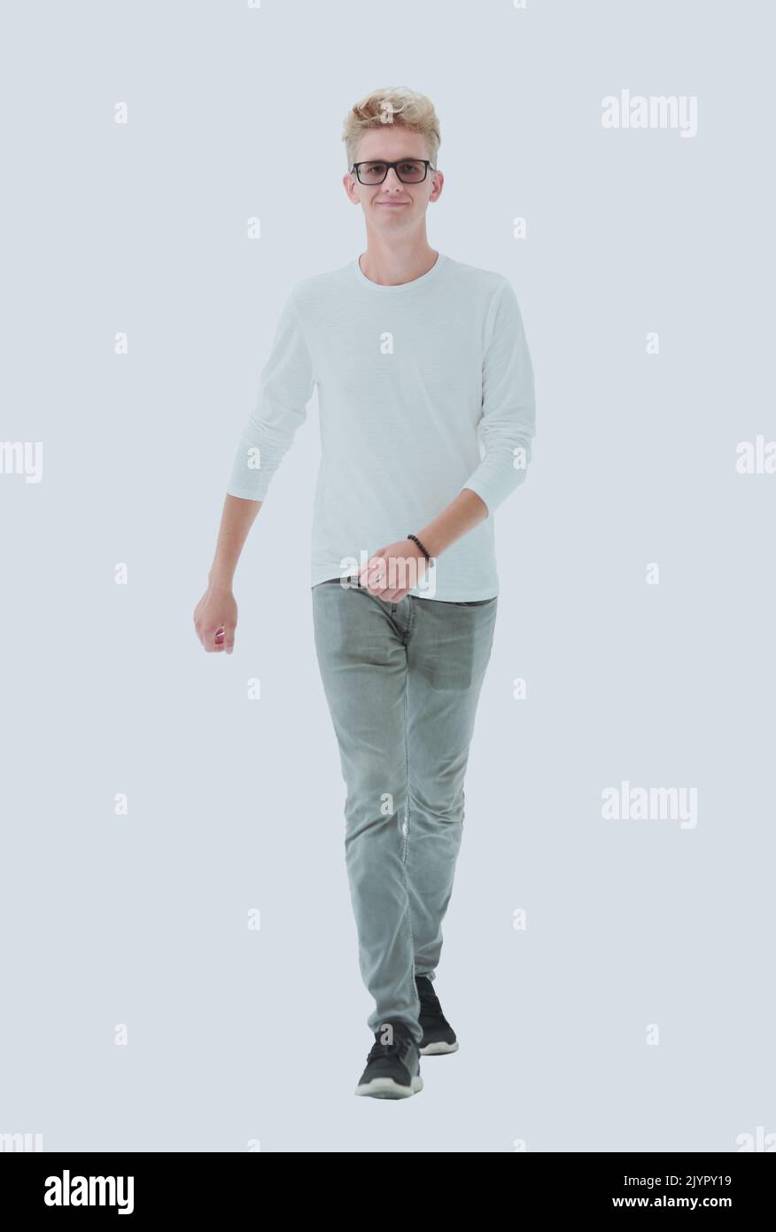 in full growth. confident young man striding forward Stock Photo - Alamy