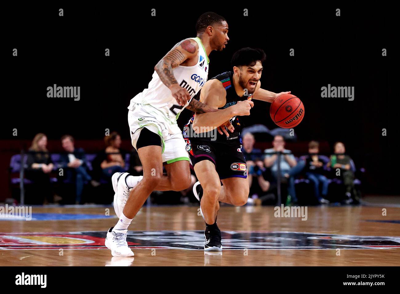 Shea Ili of United competes with Keifer Sykes of the Phoenix during ...