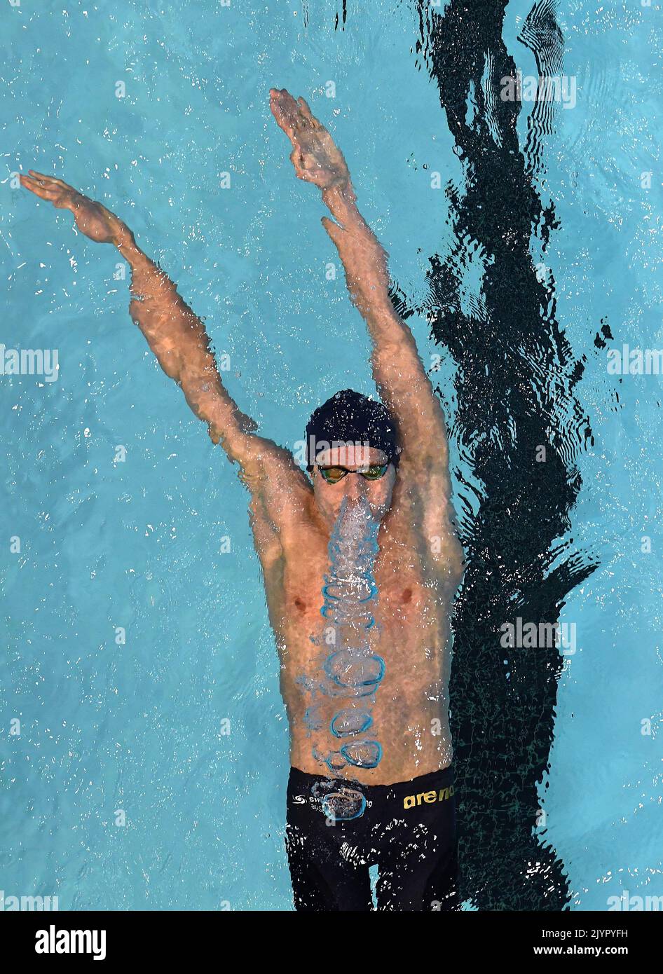 Joshua Edwards-Smith competes in the mens 100m Backstroke Heats during ...