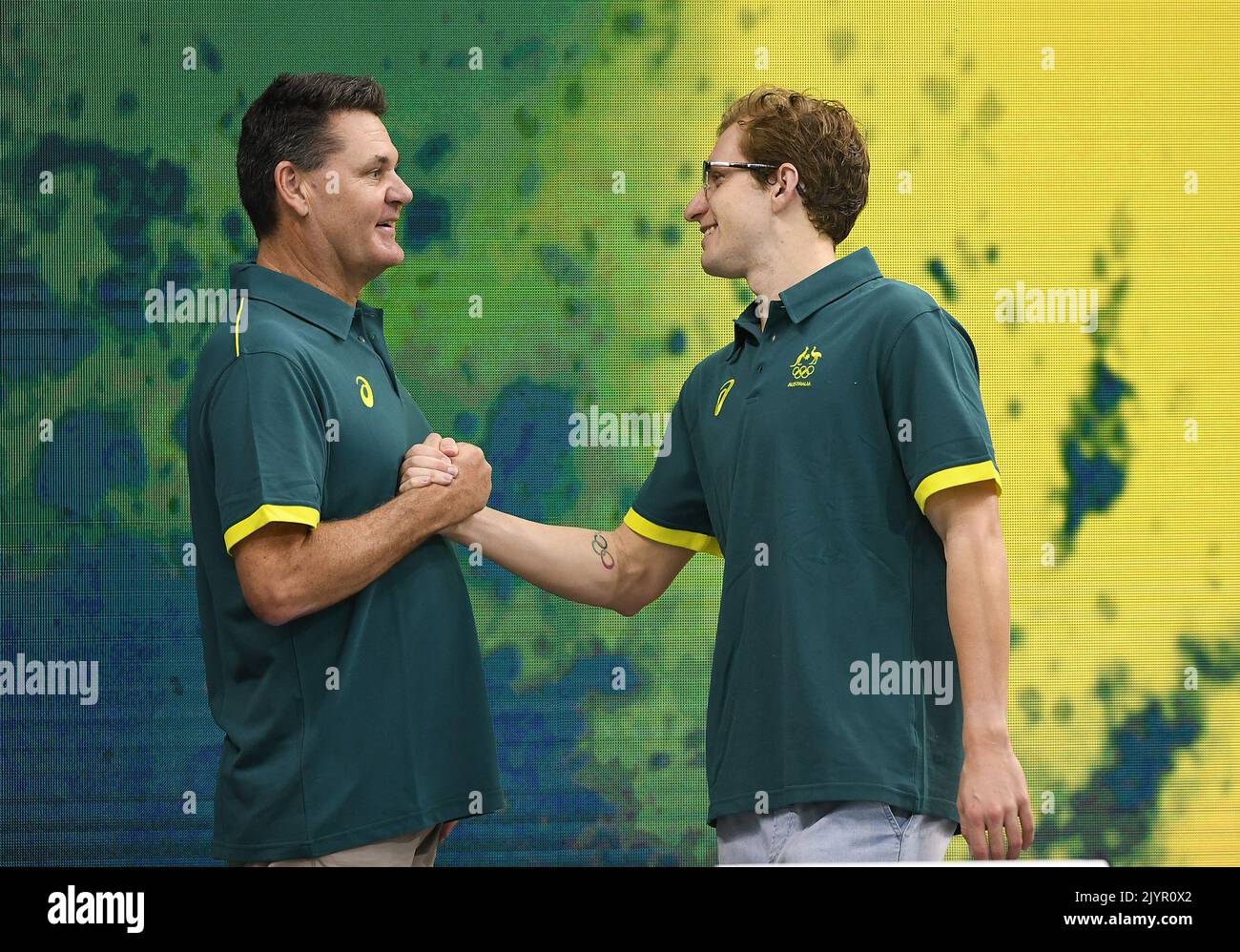 Australian national swim team coach Rohan Taylor (left) congratulates ...