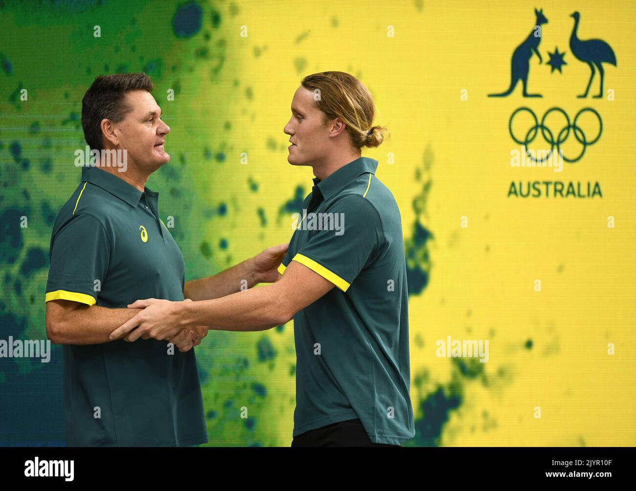 Australian national swim team coach Rohan Taylor (left) congratulates ...