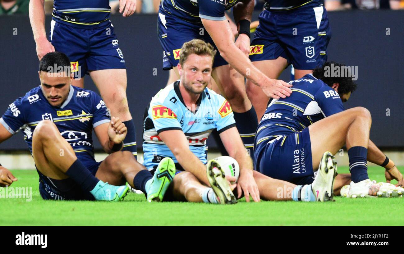 Matt Moylan of the Sharks reacts after being held up over the line ...