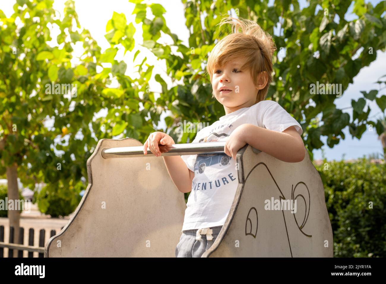 Portrait of a small little cute caucasian boy three years old thinking ...