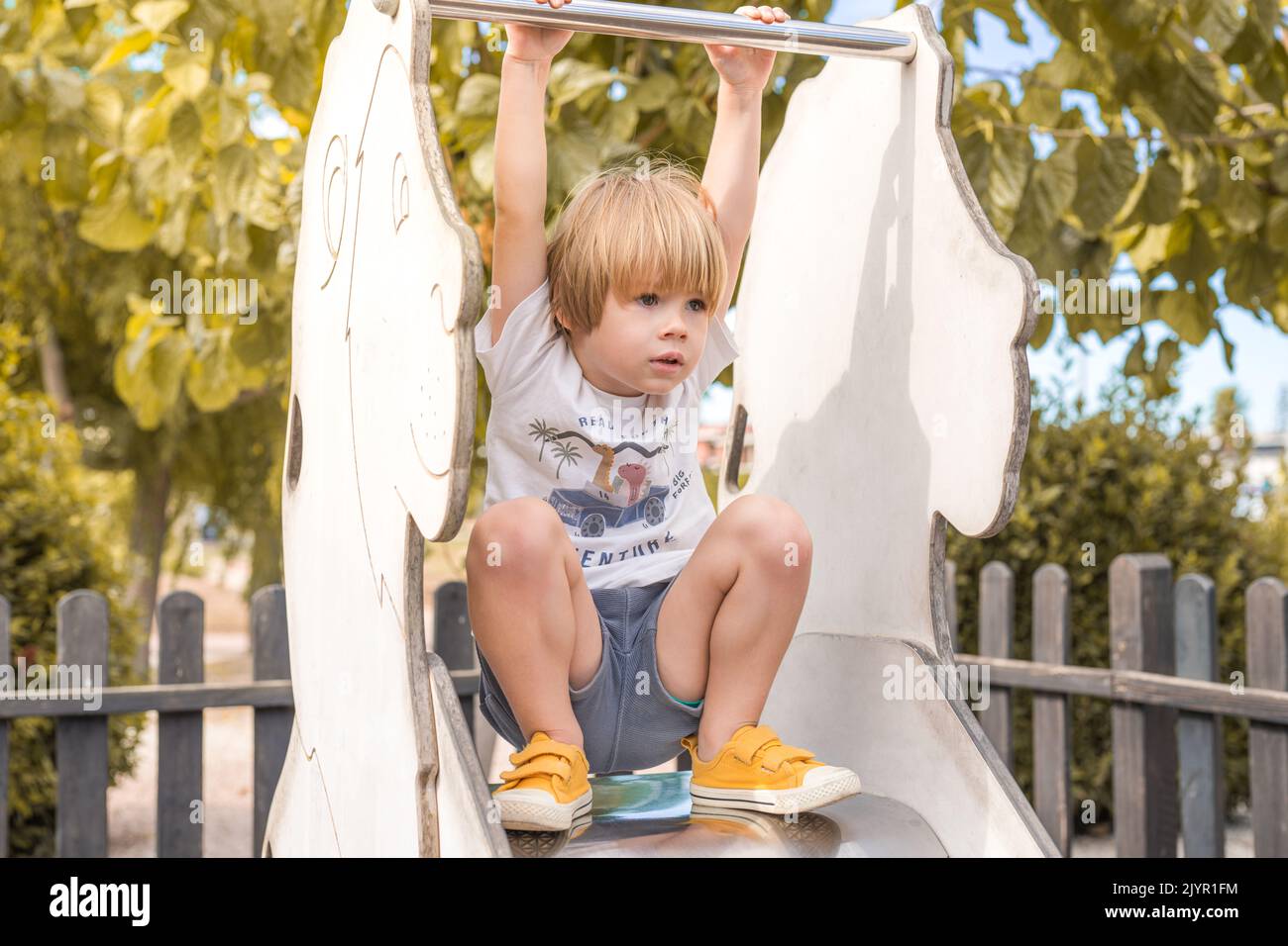 Cute 3 year old kid in a playground outdoor Stock Photo - Alamy