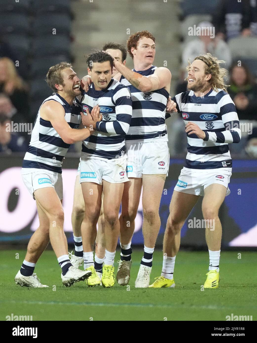 Luke Dahlhaus of the Cats is congratulated by his teammates after ...