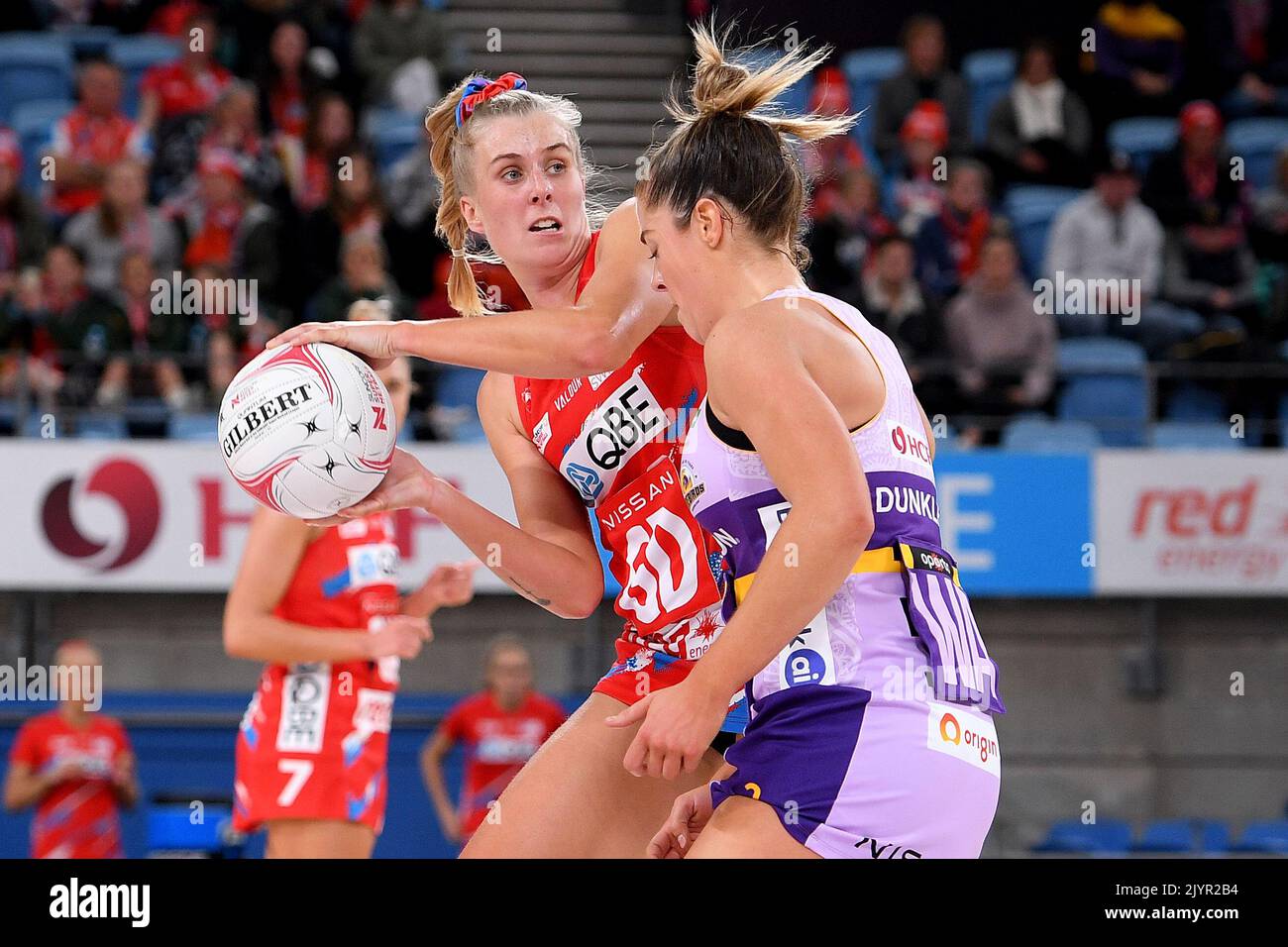 Maddy Turner of the Swifts competes with Lara Dunkley of the Firebirds ...