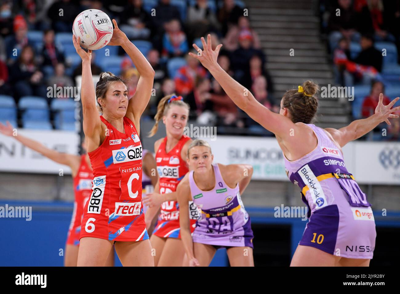 Maddy Proud of the Swifts looks to pass the ball during the Super ...
