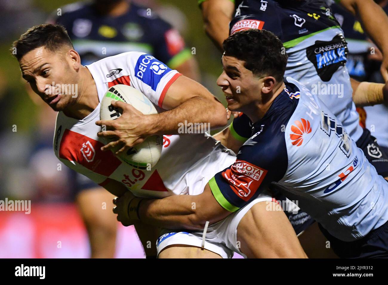 Corey Norman of the Dragons looks to score as Bailey Simonsson of the ...