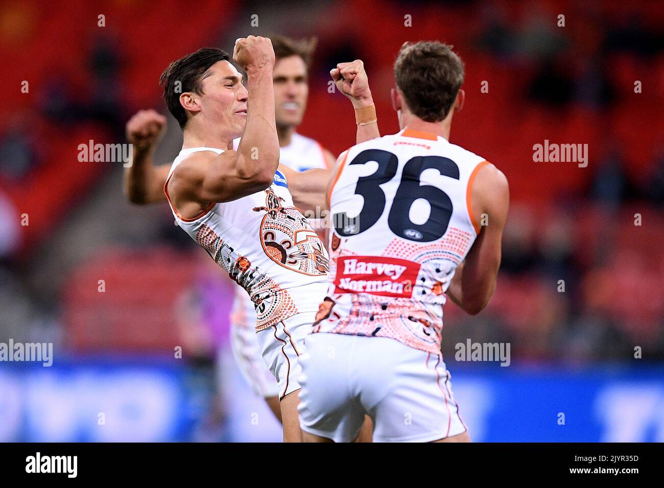 Isaac Cumming of the Giants celebrates after kicking a goal during the ...