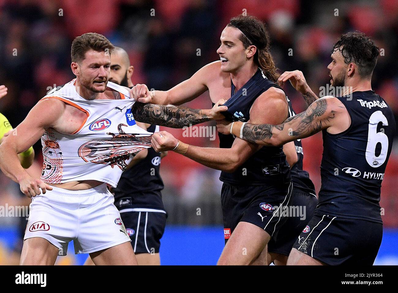Daniel Lloyd of the Giants (left) scuffles with Luke Parks of the Blues ...
