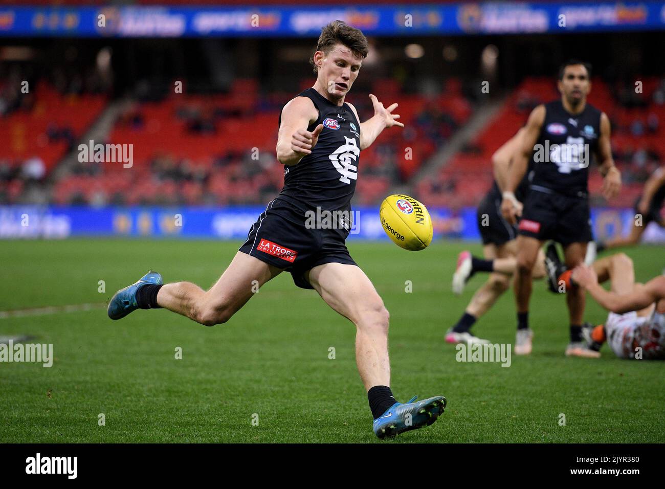 Sam Walsh of the Blues kicks during the AFL Round 14 match between GWS ...