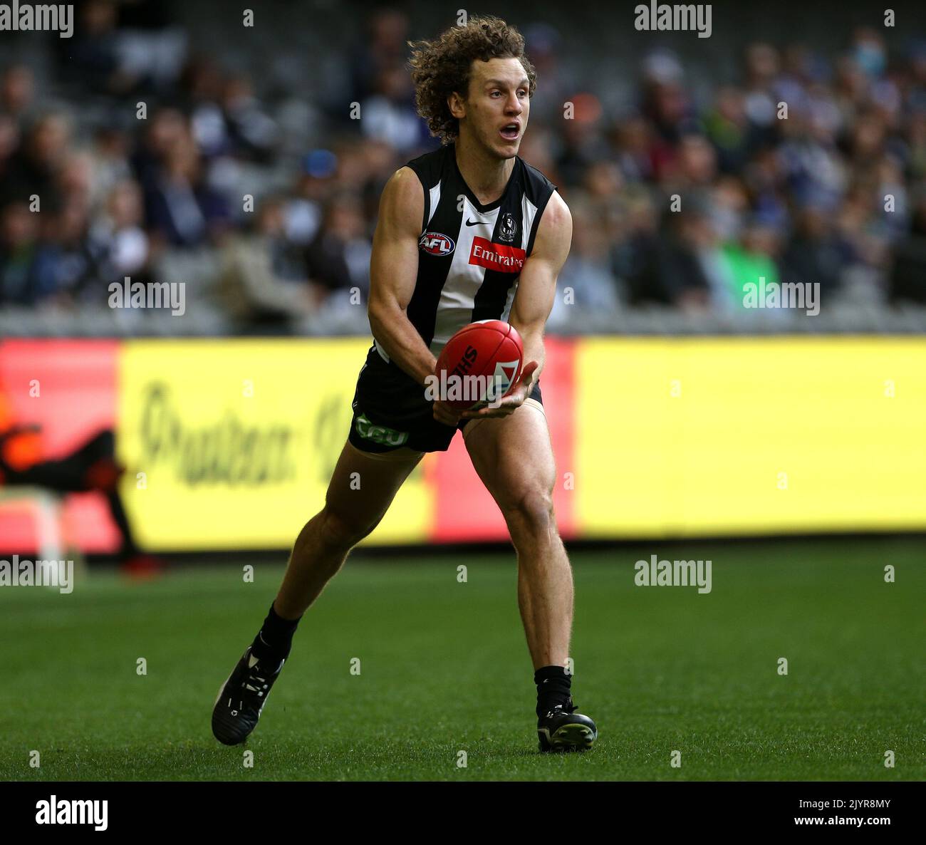 Chris Mayne of the Magpies runs forward during the AFL Round 15 match ...