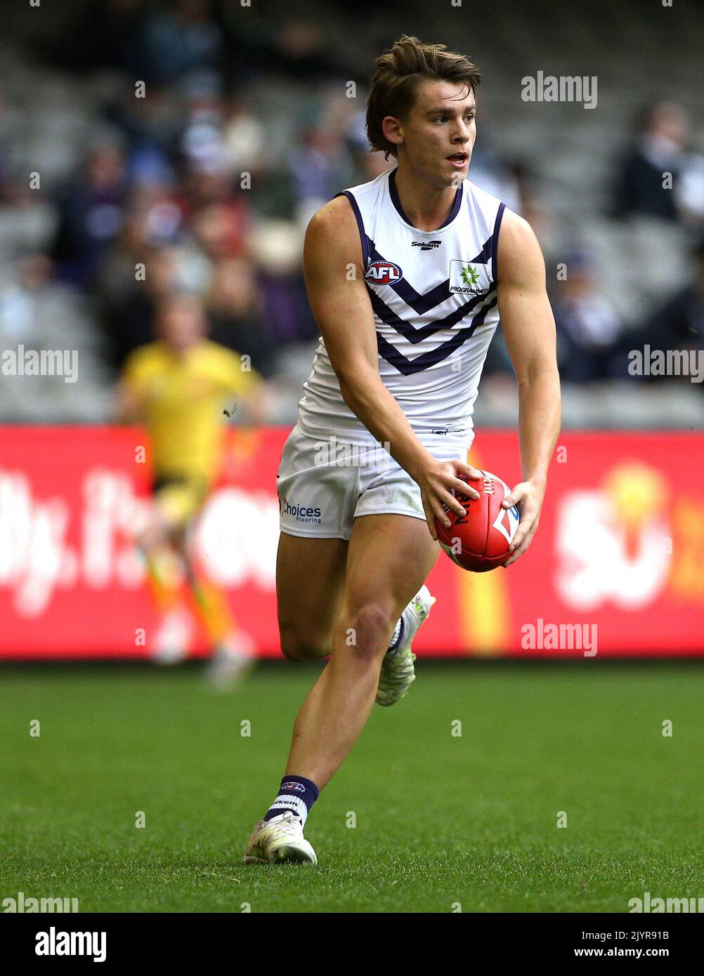 Caleb Serong of the Dockers runs forward during the AFL Round 15 match ...